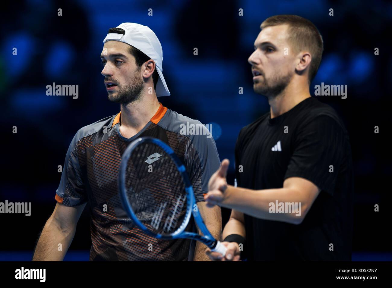Julian Cash (L) and Lloyd Glasspool of Great Britain are seen during ...
