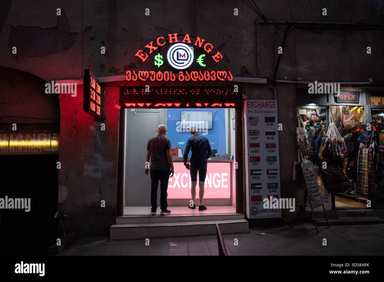 Tourists seen changing money at a currency exchange office in the old ...