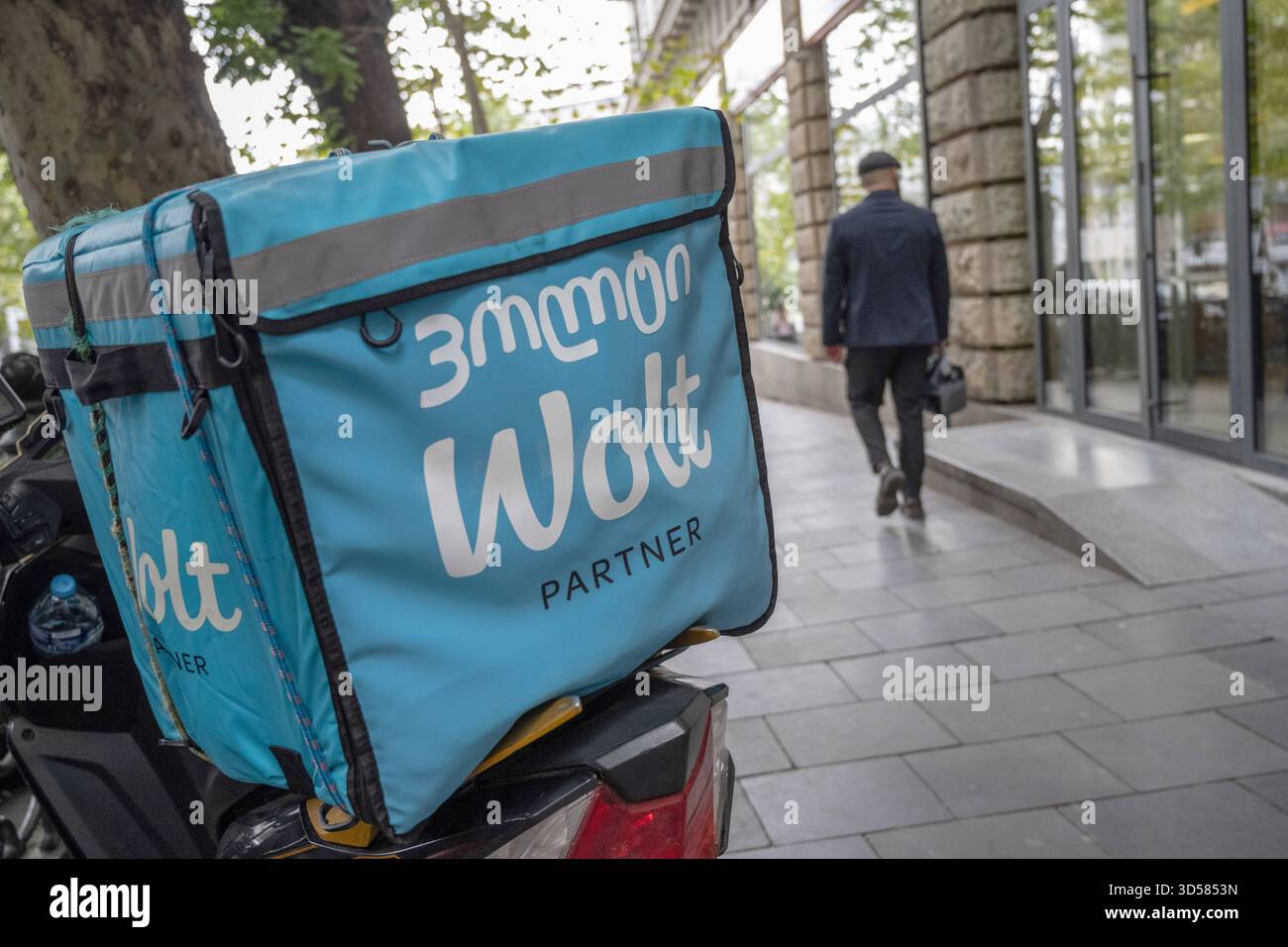 A Wolt food delivery motorcycle seen parked on a side street. The ...