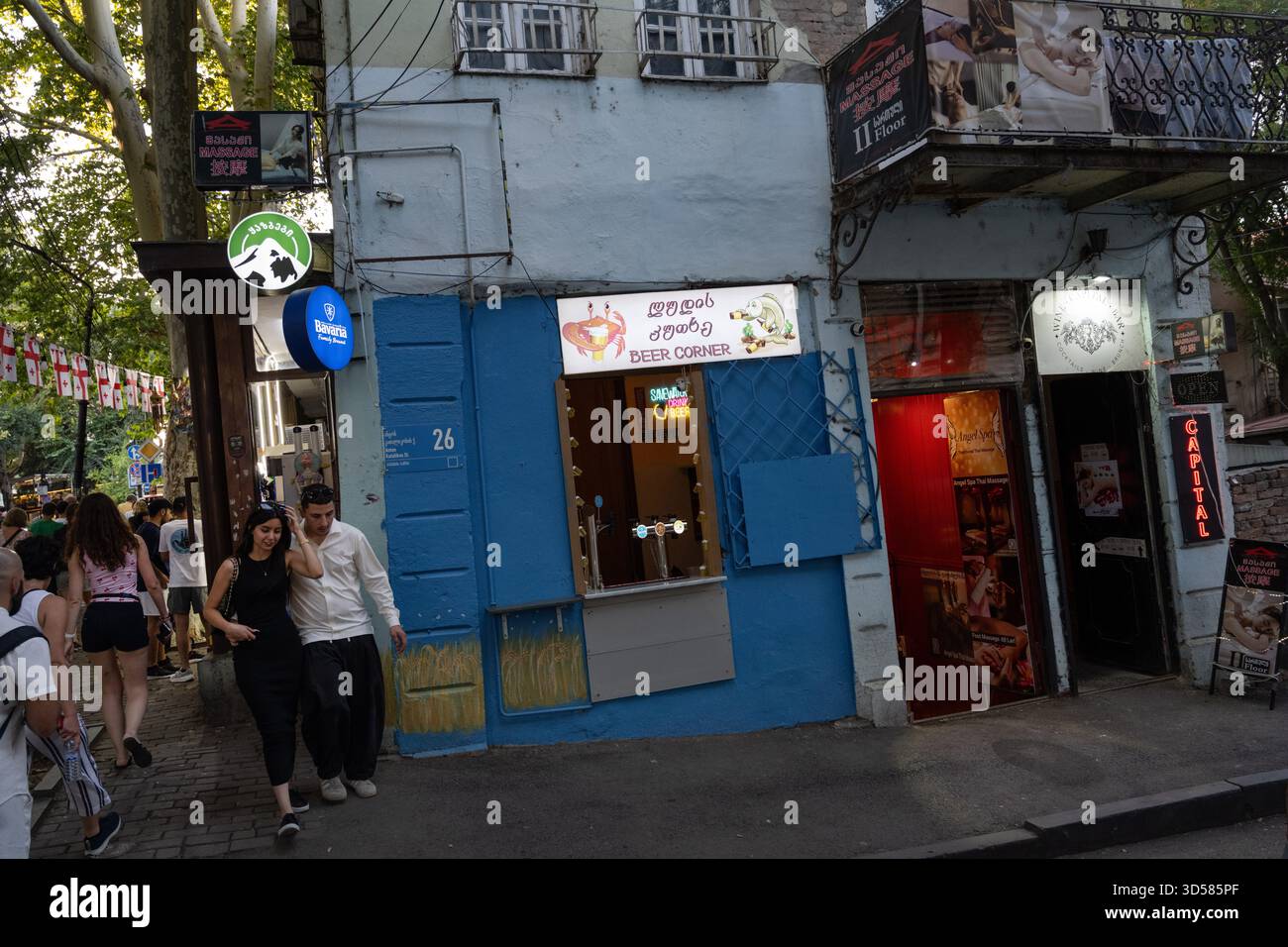 Busy nightlife with people visiting bars, cafes and restaurants in the ...