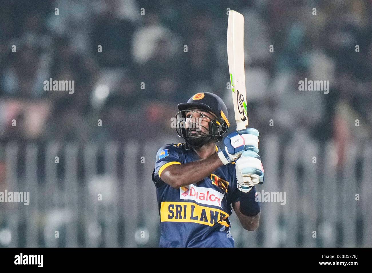 Sri Lanka's Janith Liyanage follows the ball after hitting a six during ...