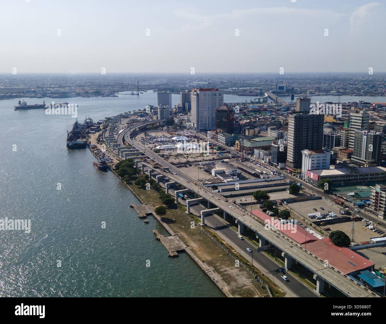 Aerial view of a bustling cityscape where the deep blue waters of the ...