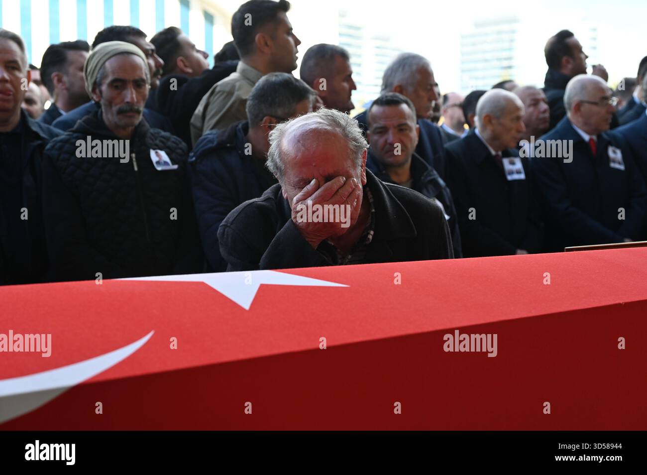 Relatives mourn during the funeral of Turkish military personnel Umit ...