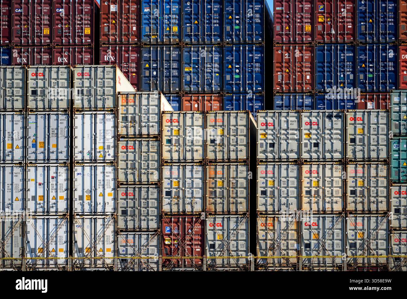 Cargo containers are seen on the Cosco Pride as the ship is moved to ...