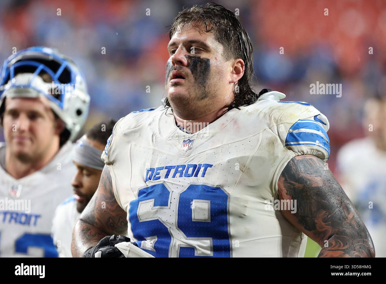 Detroit Lions guard Tate Ratledge (69) looks on after an NFL football ...