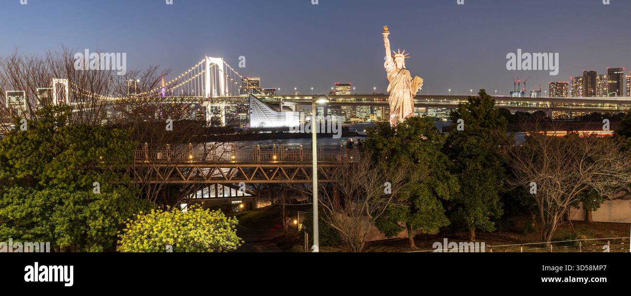 Tokyo, Japan - March 14, 2025: Panorama with illuminated Odaiba Statue ...