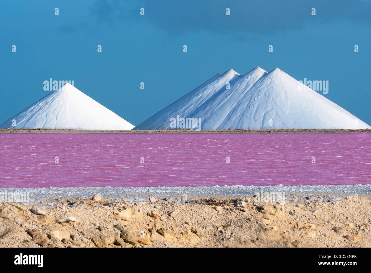 The Salty Pyramids viewed through pink saline lake, Bonaire, Caribbean ...
