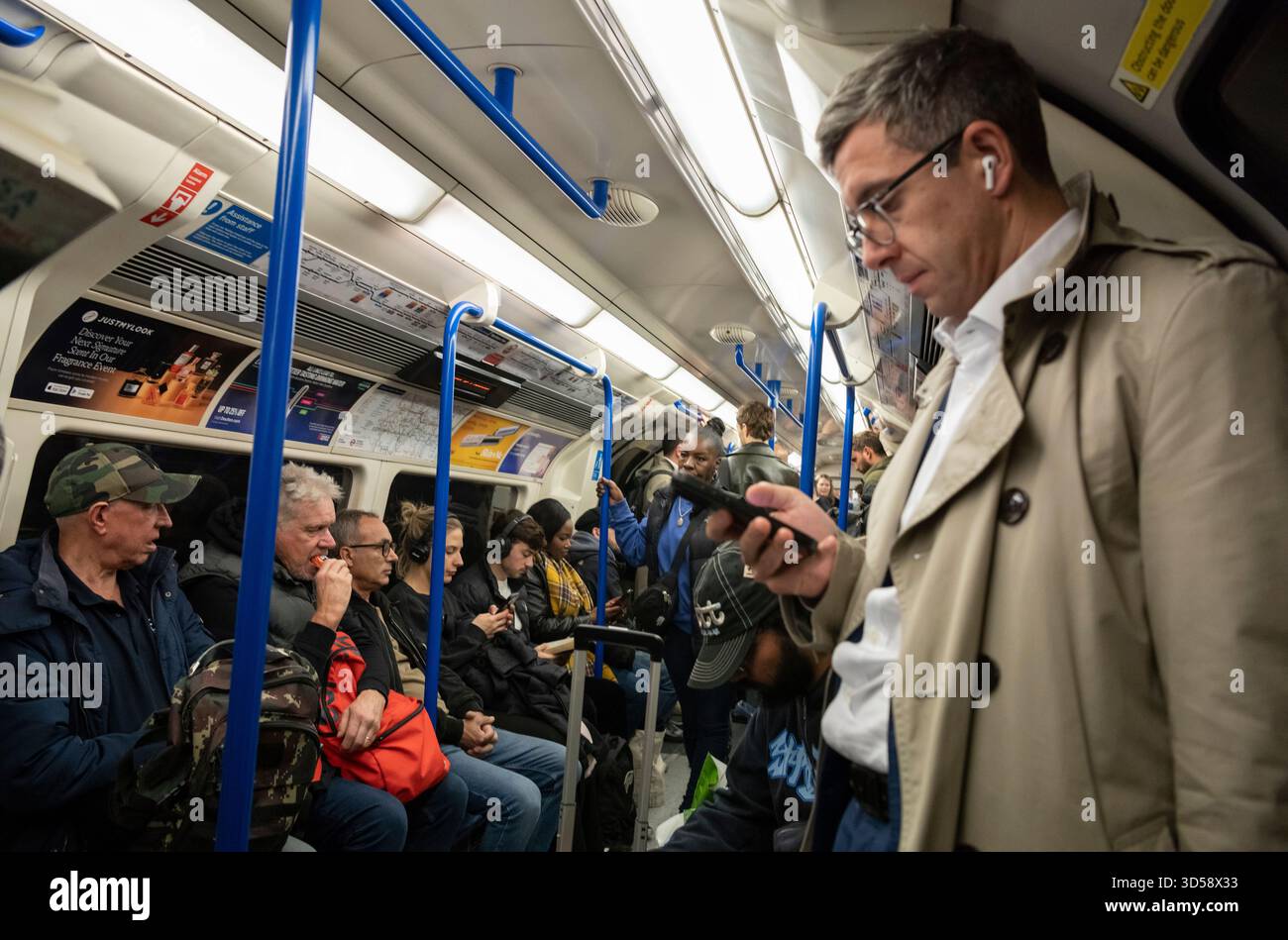 London commuters squashed into a London Underground carriage as they ...