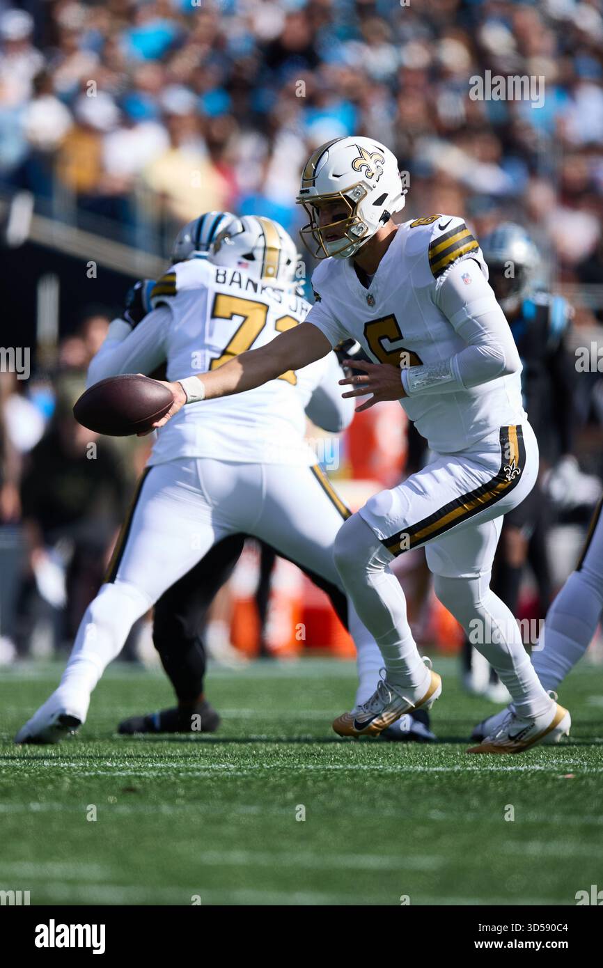 New Orleans Saints quarterback Tyler Shough (6) turns to hand the ball ...
