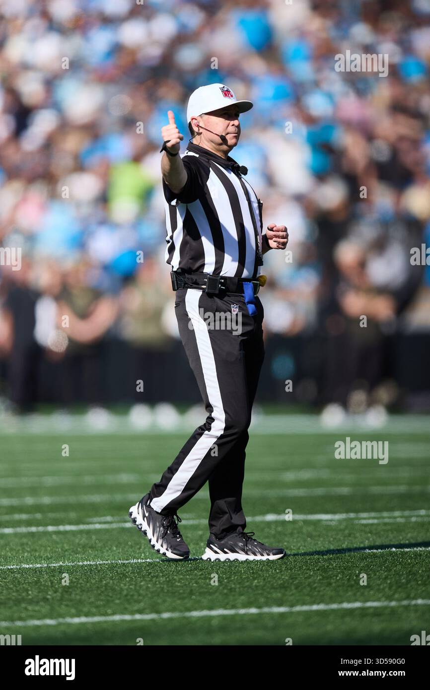 Referee Brad Allen (122) gives a thumbs-up sign during an NFL football ...