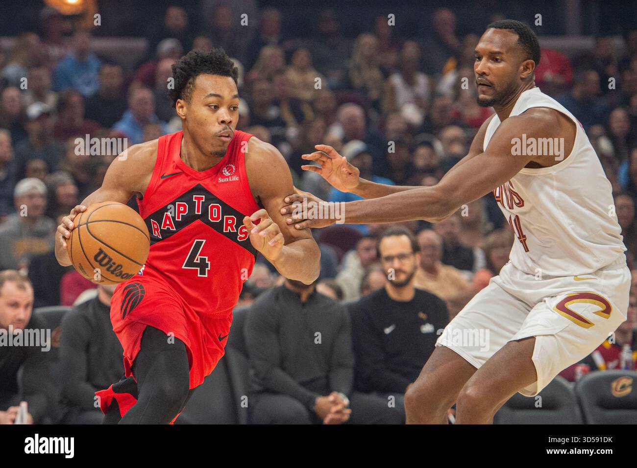 Toronto Raptors' Scottie Barnes, left, drives against Cleveland ...