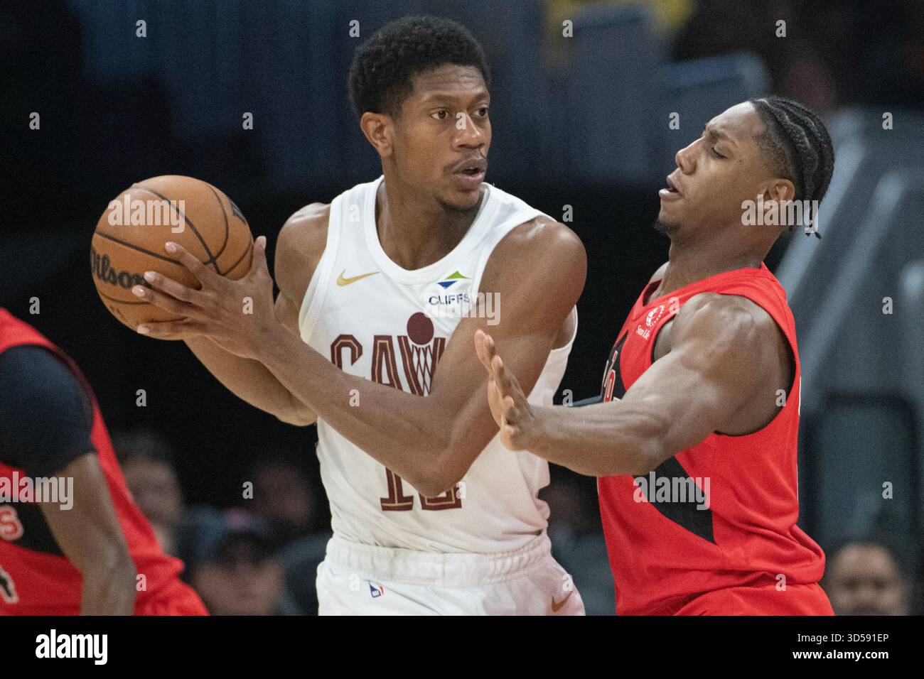 Cleveland Cavaliers' De'Andre Hunter (12) keeps the ball from Toronto ...
