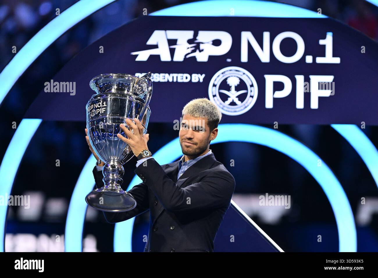 Carlos Alcaraz (ESP) holds the 2025 Year-End ATP World No.1 Trophy ...