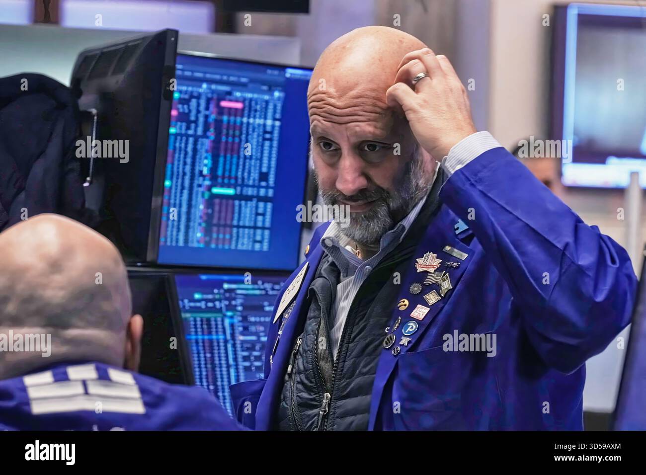 Specialist Meric Greenbaum works on the floor of the New York Stock ...