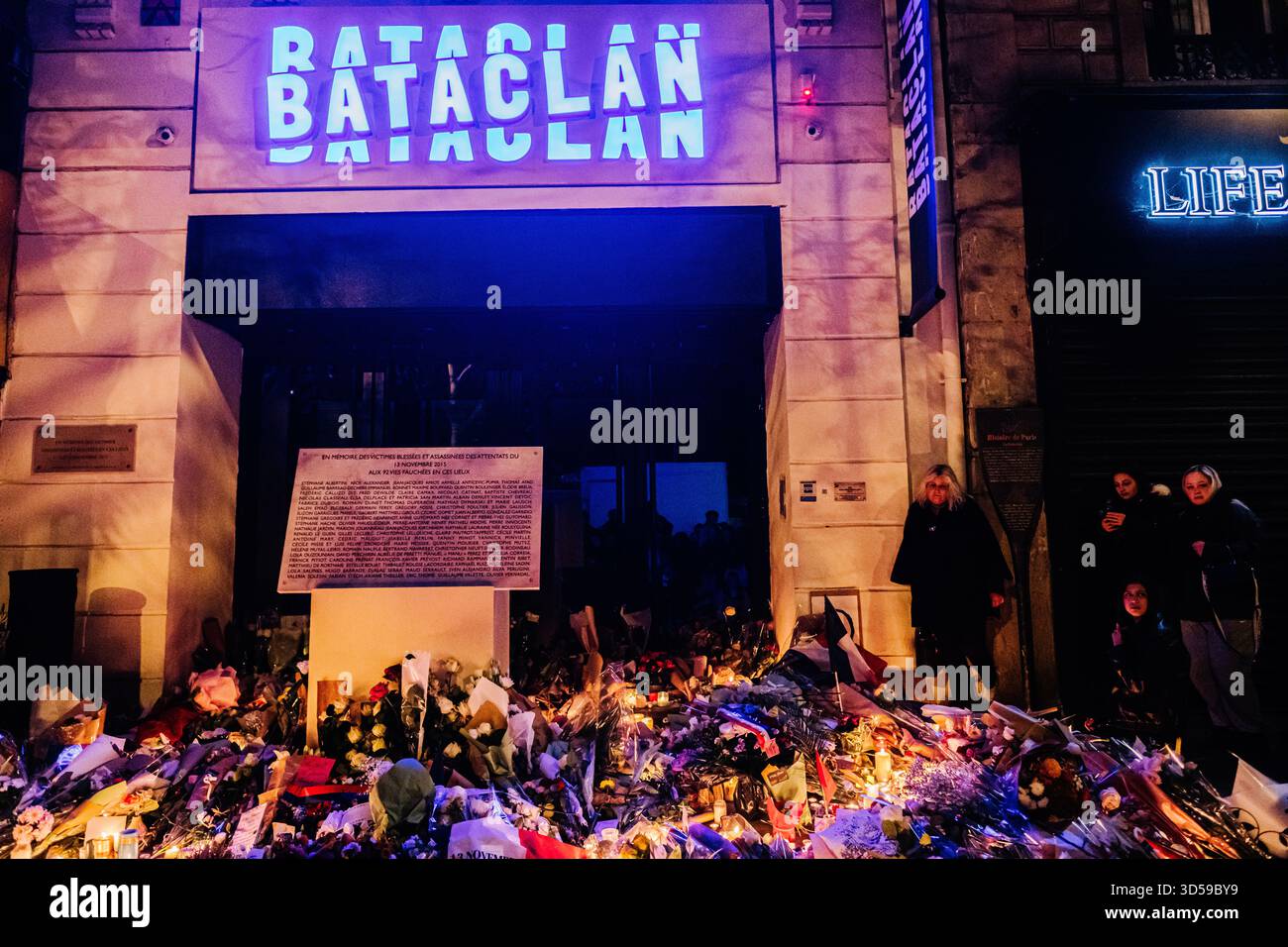 Tributes in front of the Bataclan theatre to the victims of the Paris ...