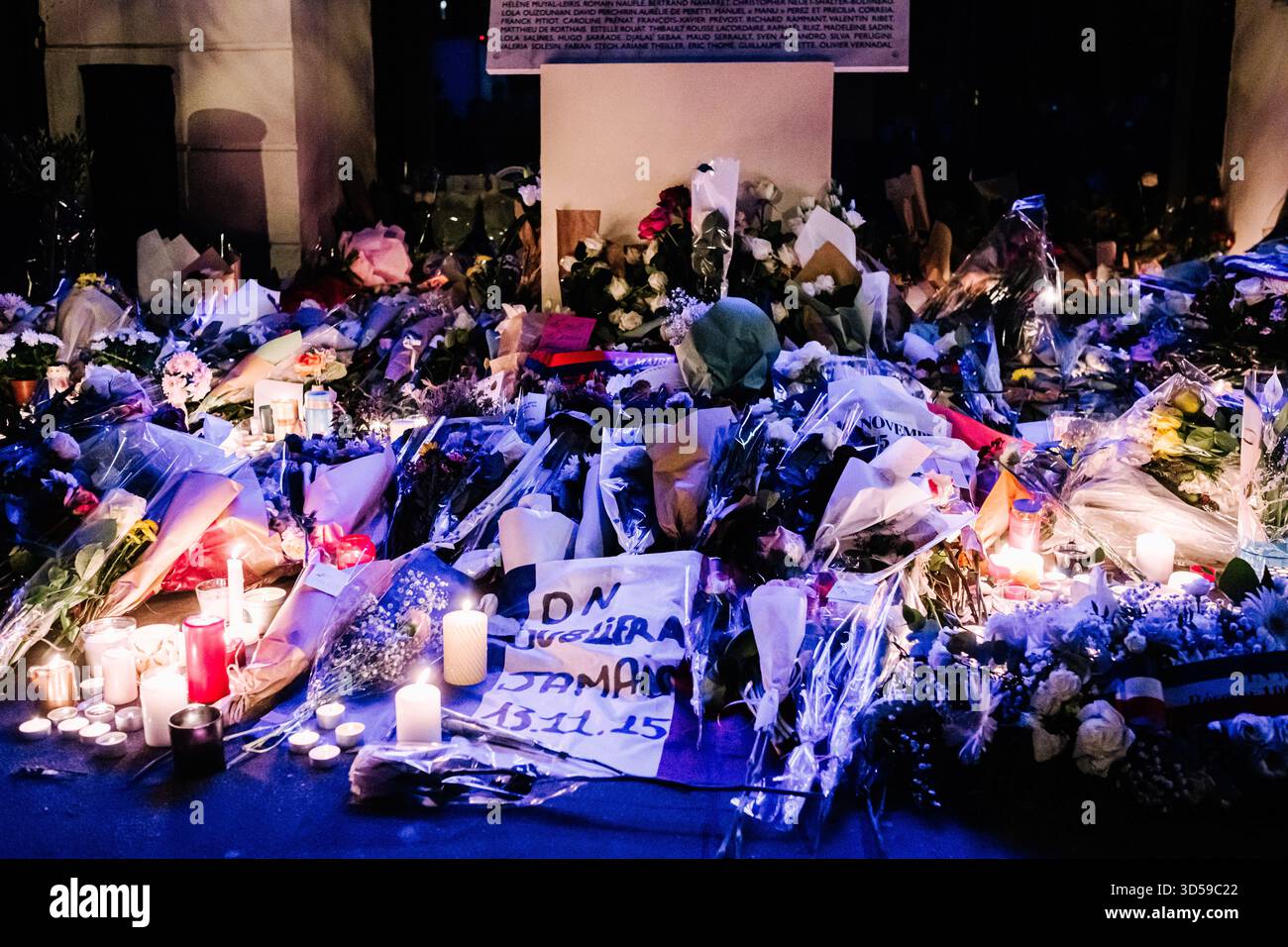 Tributes in front of the Bataclan theatre to the victims of the Paris ...