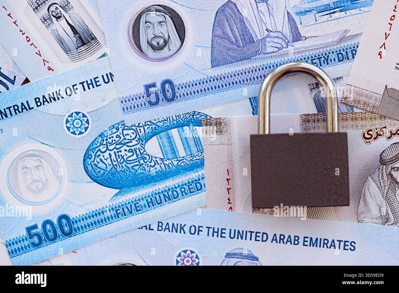 United Arab Emirates dirham currency money bills and padlock close up ...