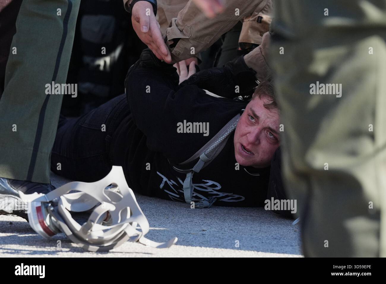 Illinois State police detain a protester outside an ICE processing ...