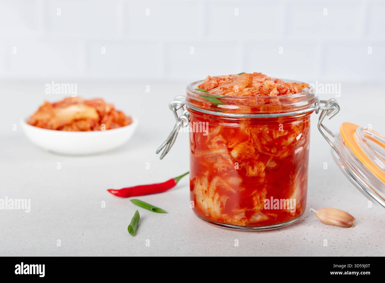 Traditional Korean kimchi in a glass jar on white background. Fermented ...