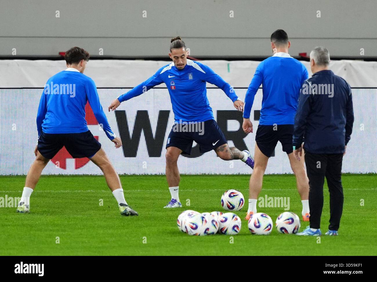 Greece's Konstantinos Tsimikas (centre) during a training session at ...