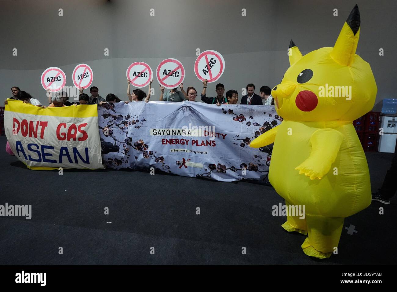 Activists, and one dressed in a Pikachu costume, protest Japan's ...