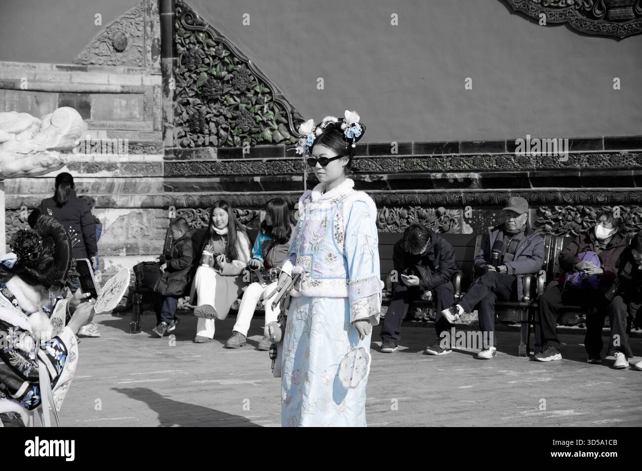 Hanfu pose by the imperial wall as her friend slouches to snap the shot ...