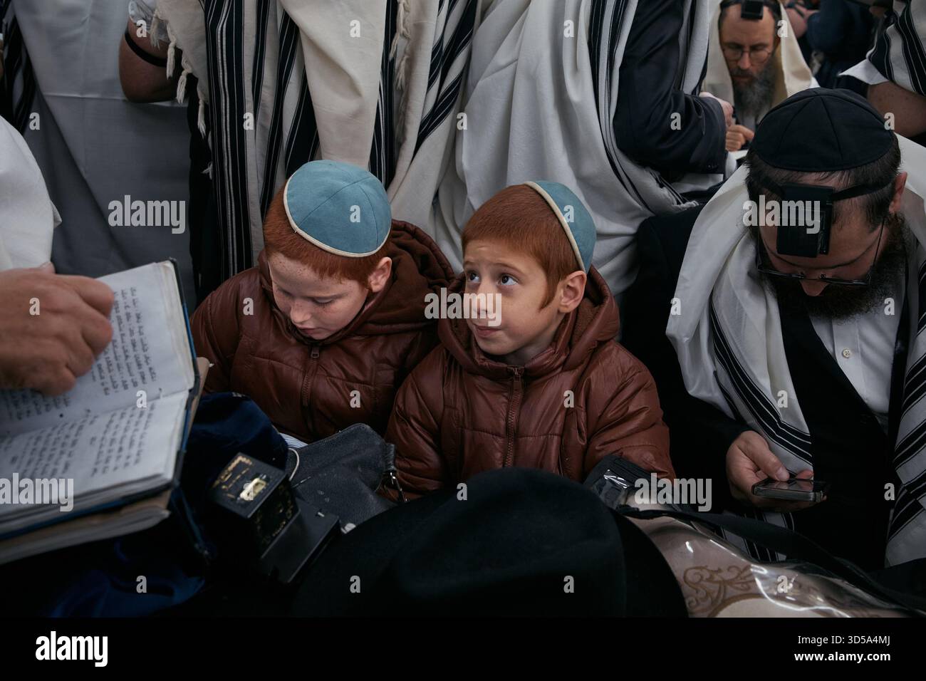 Children write letters as Chabad-Lubavitch rabbis gather in prayer at ...