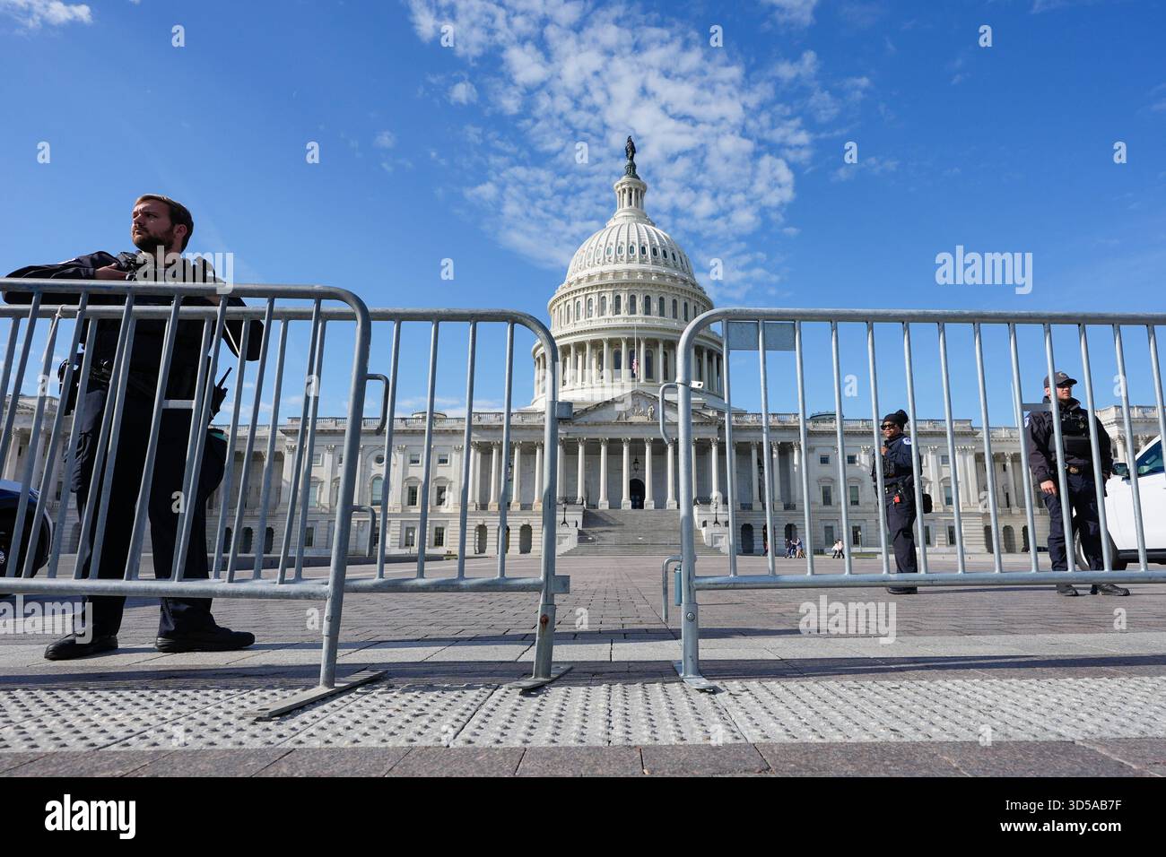 U.S. Capitol Police officers stand near security fencing at the U.S ...