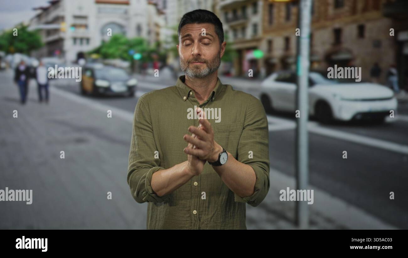 Man clasping hands on busy hi-res stock photography and images - Alamy