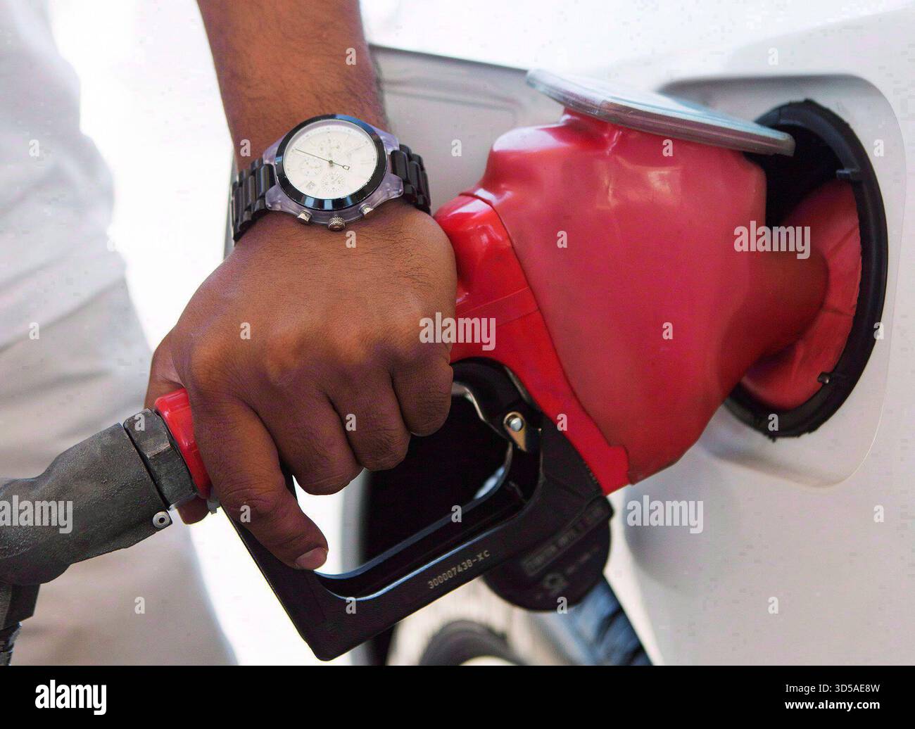 A person pumps fuel in Toronto, on Wednesday, September 12, 2012. THE ...