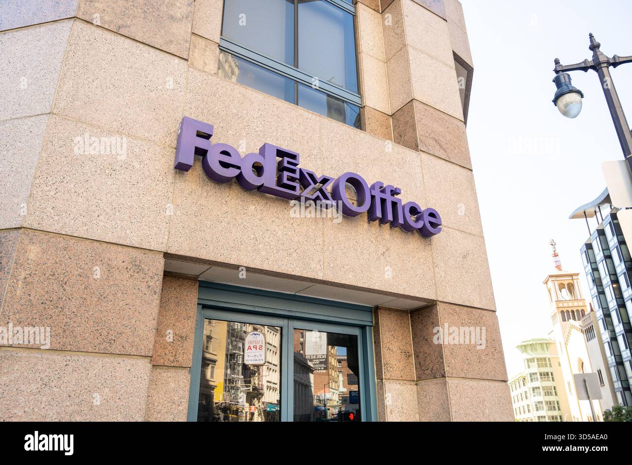 FedEx Office storefront sign on stone facade of office building, downtown San Francisco ...