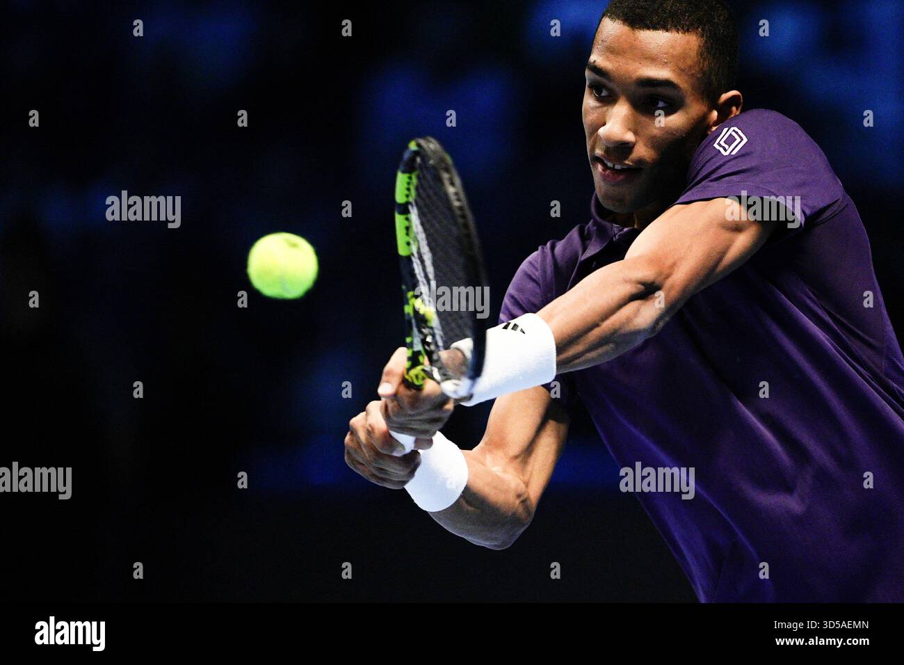 Canada's Felix Auger Aliassimereturns the ball to Germany's Alexander ...