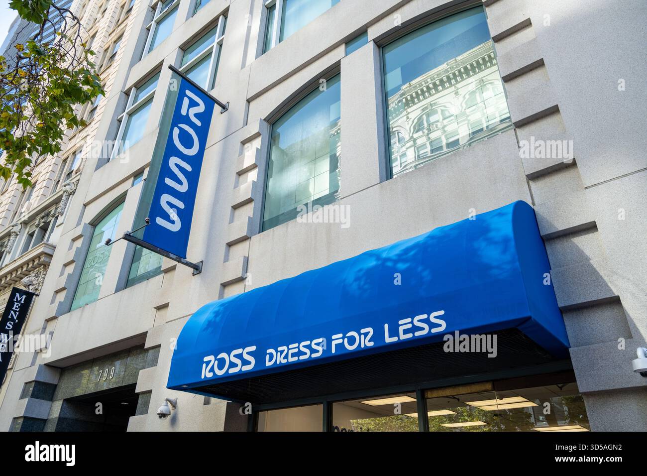 Ross Dress for Less storefront with blue awning and vertical sign on ...