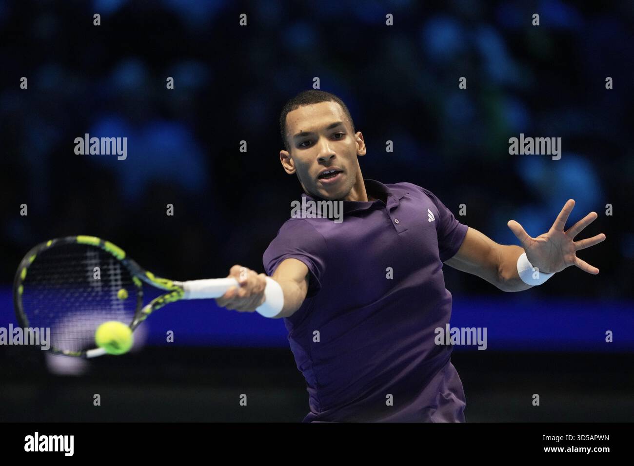 Canada's Felix Auger-Aliassime returns the ball to Germany's Alexander ...