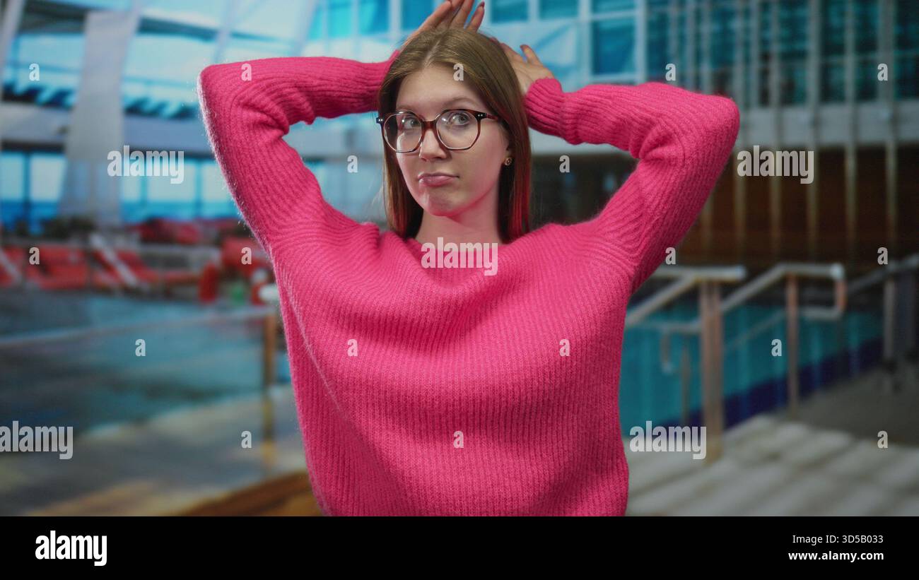 Woman raises arms above head hi-res stock photography and images - Alamy