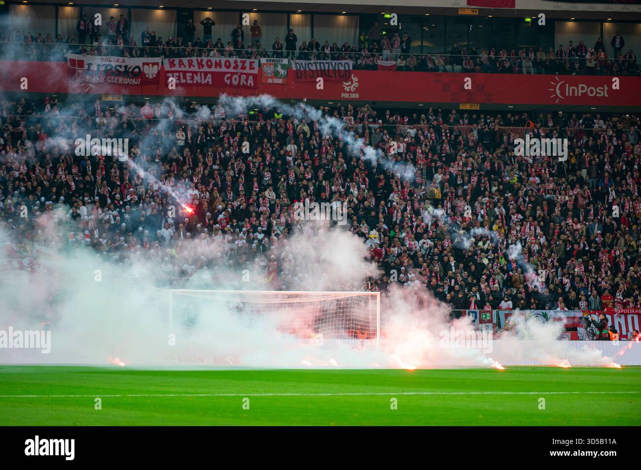 Polish fans throw flares onto the field during the FIFA World Cup 2026 ...