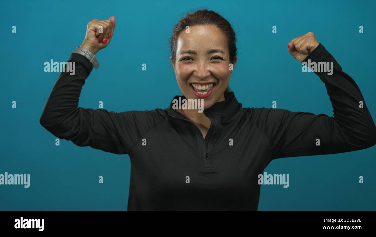 Woman raises arms flex hi-res stock photography and images - Alamy