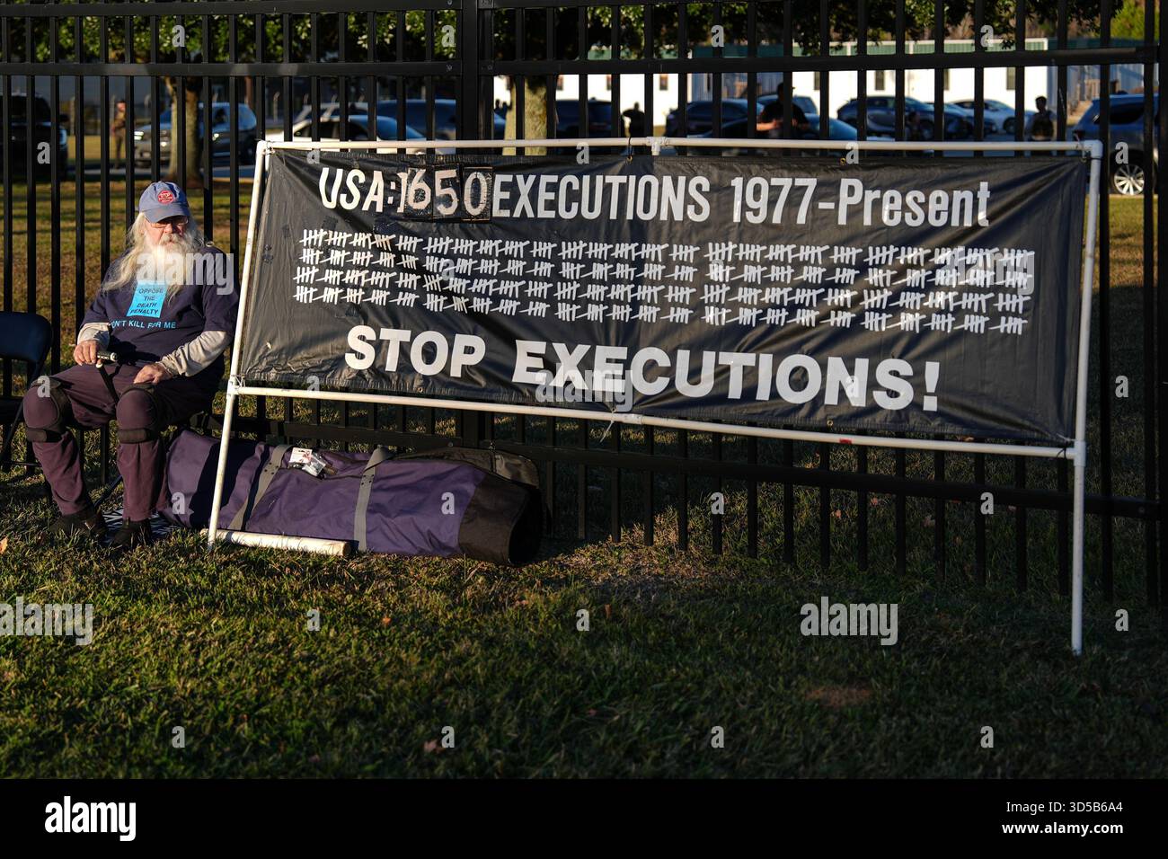 A protester looks on outside of Broad River Correctional Institute ...