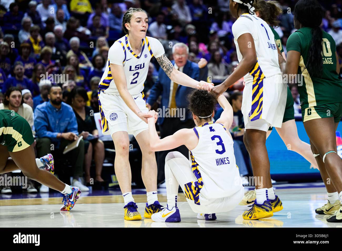 LSU forward Grace Knox (2) helps LSU guard Bella Hines (3) up in the ...