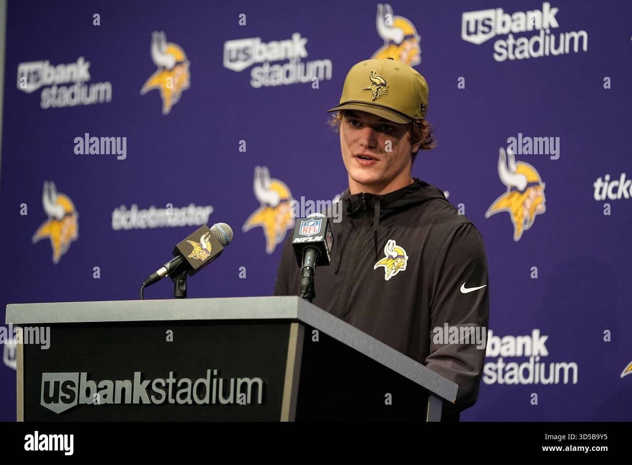 Minnesota Vikings quarterback J.J. McCarthy talks to reporters after an ...