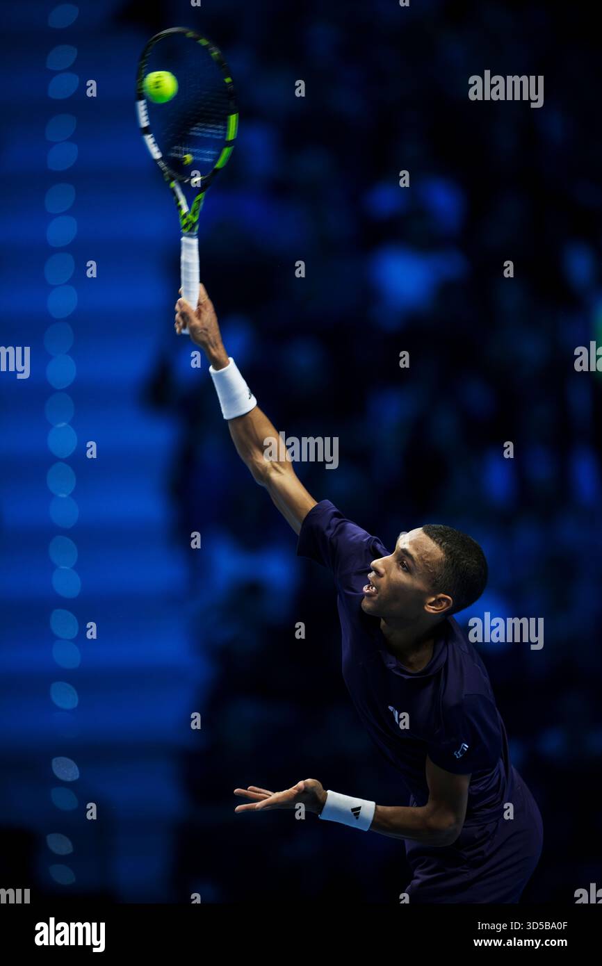 Felix Auger-Aliassime of Canada serves during his round robin singles match against Alexander ...