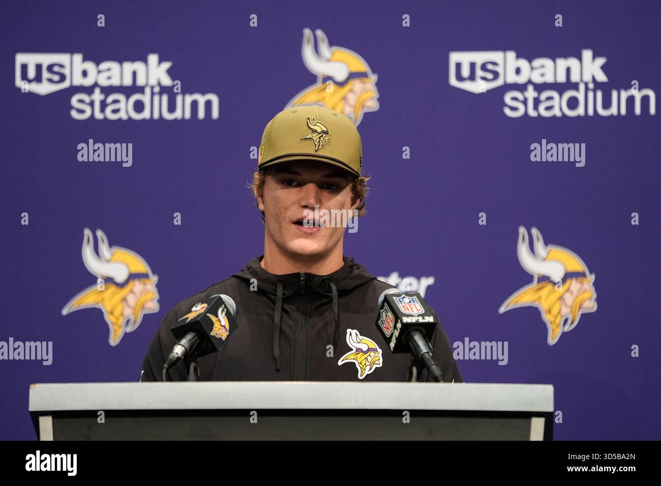 Minnesota Vikings quarterback J.J. McCarthy talks to reporters after an ...