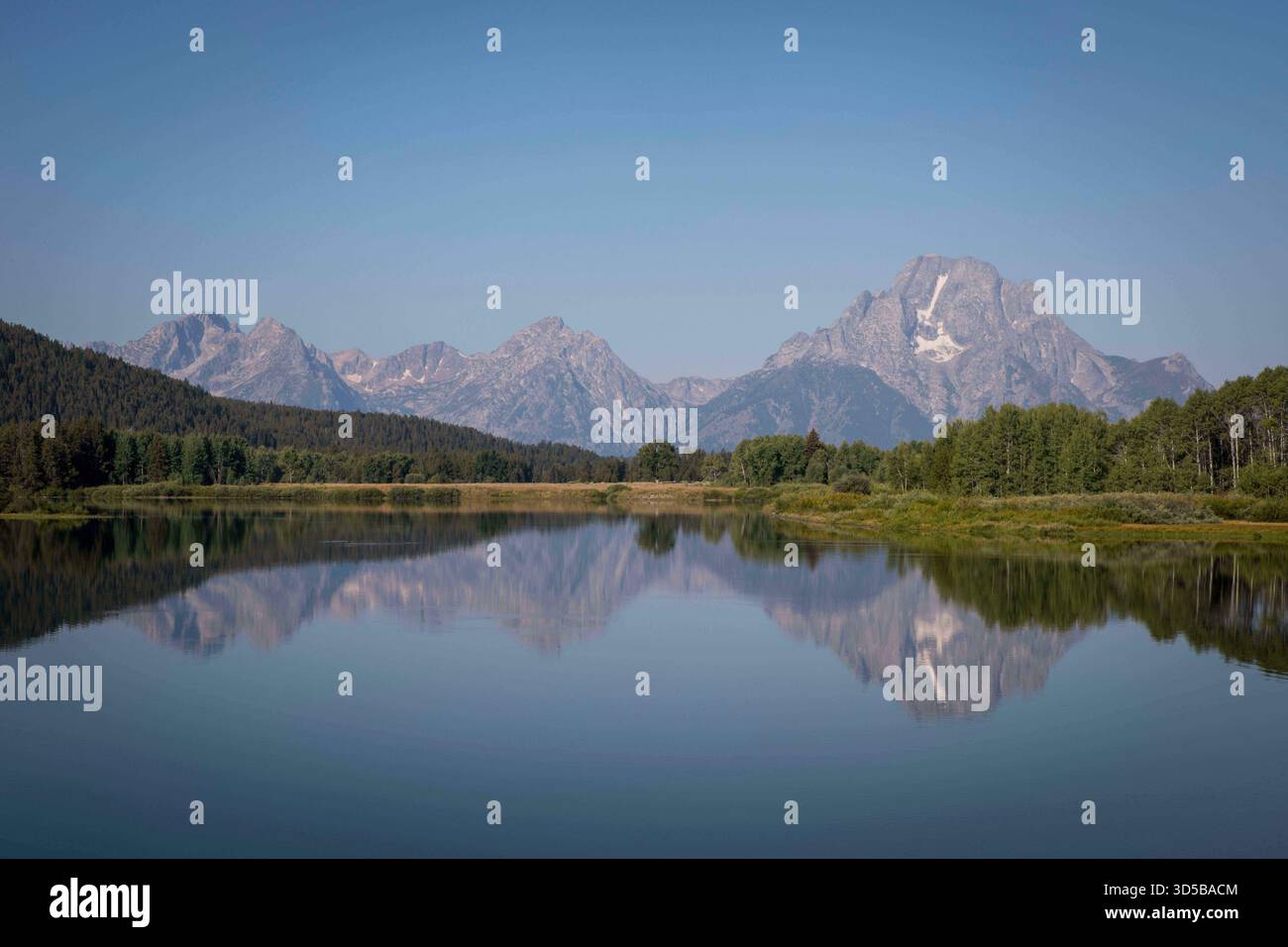 FILE - The Teton mountains reflect on Oxbow Bend in Grand Teton ...