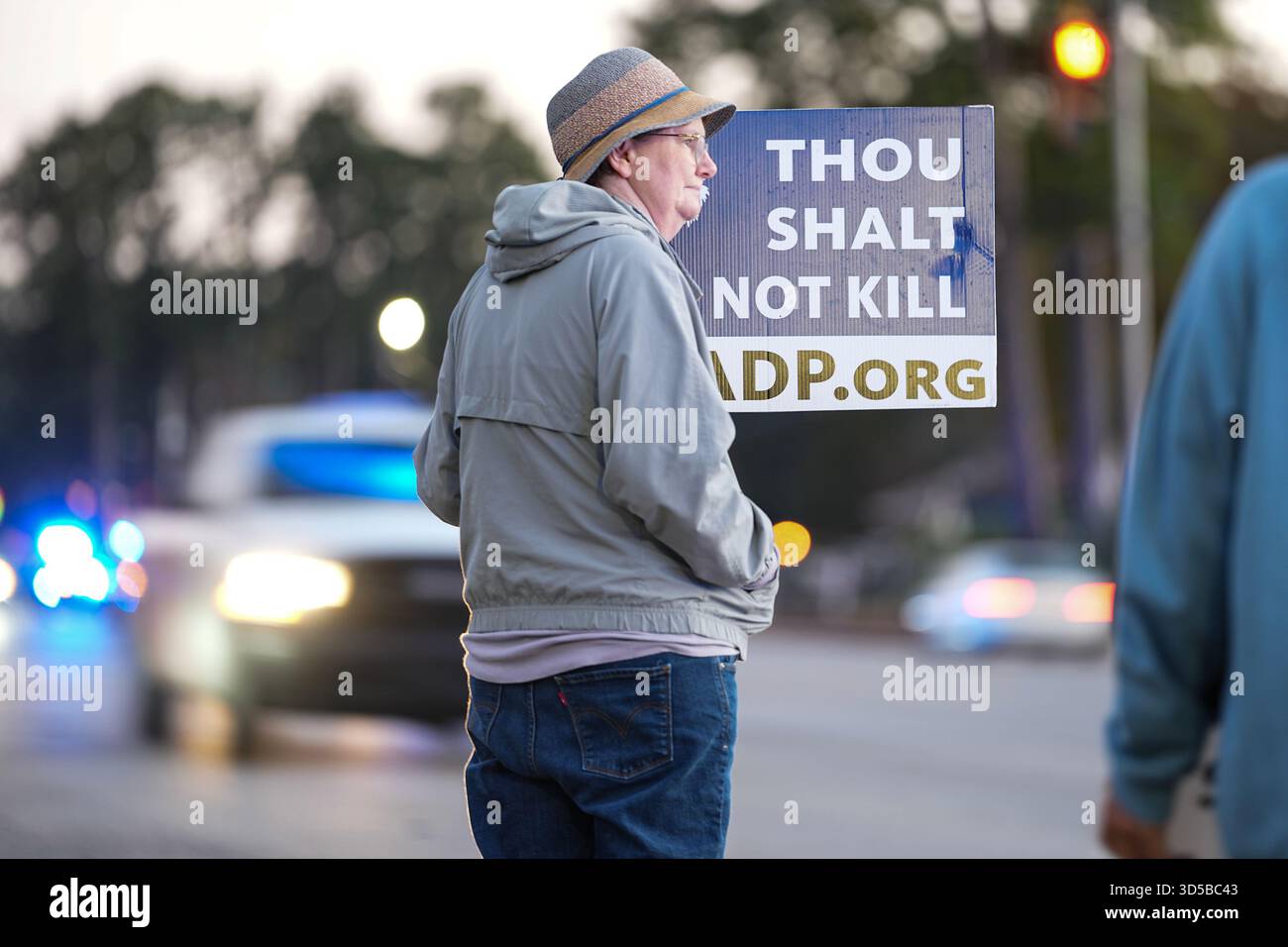 A protestor holds a sign outside of the Broad River Correctional ...