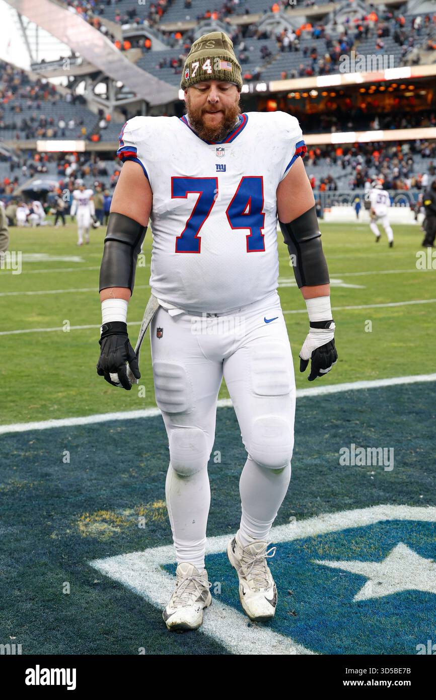 New York Giants guard Greg Van Roten (74) walks off the field after an ...