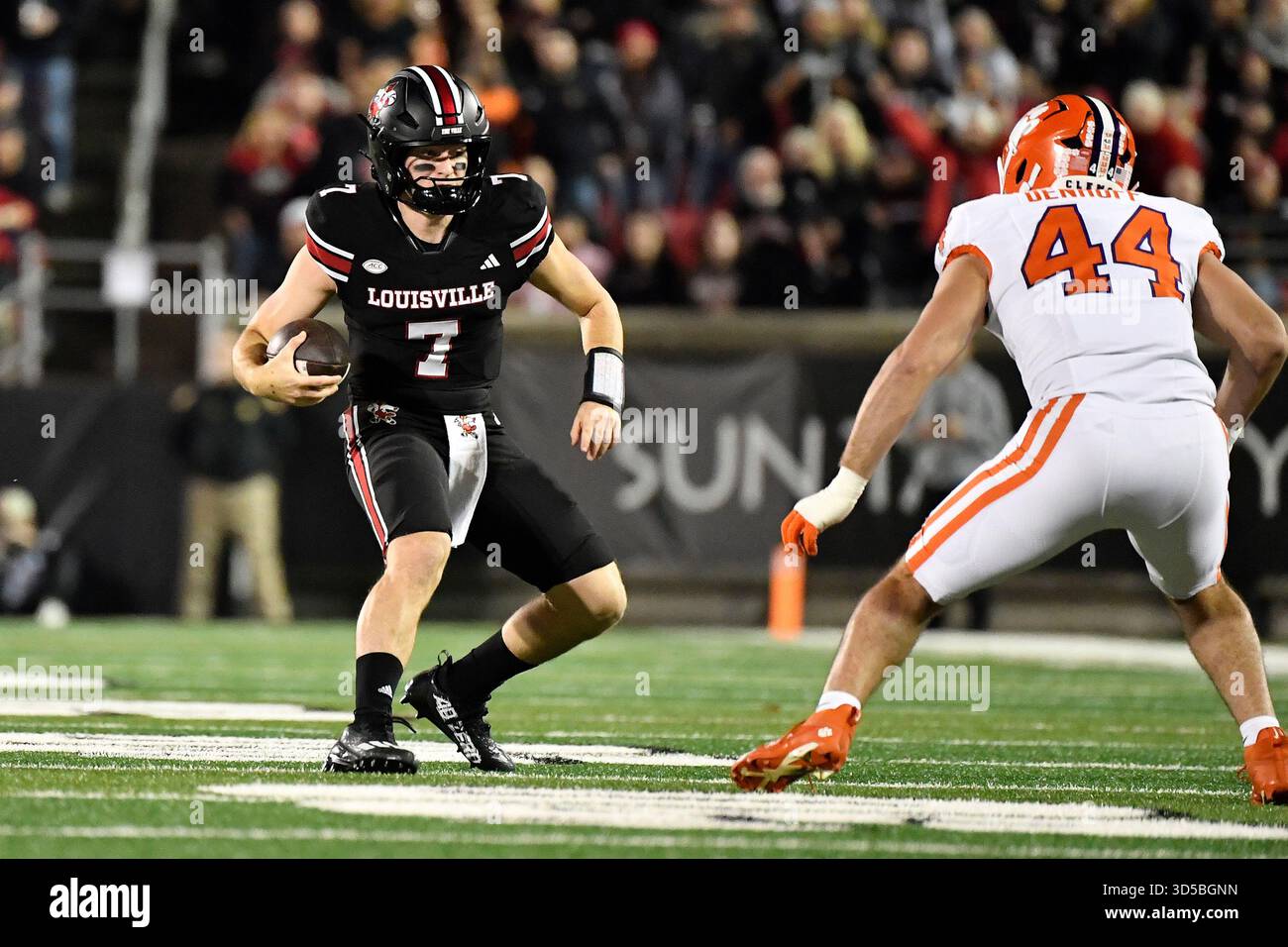 Louisville quarterback Miller Moss (7) attempts to get away from ...