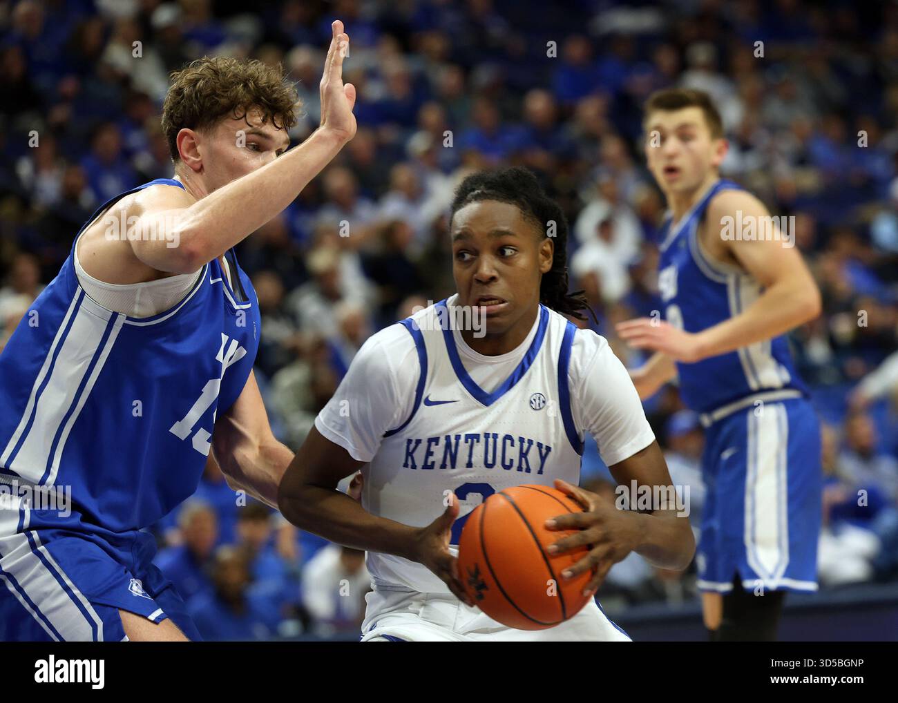 Kentucky's Jasper Johnson, front right, looks for an opening against ...