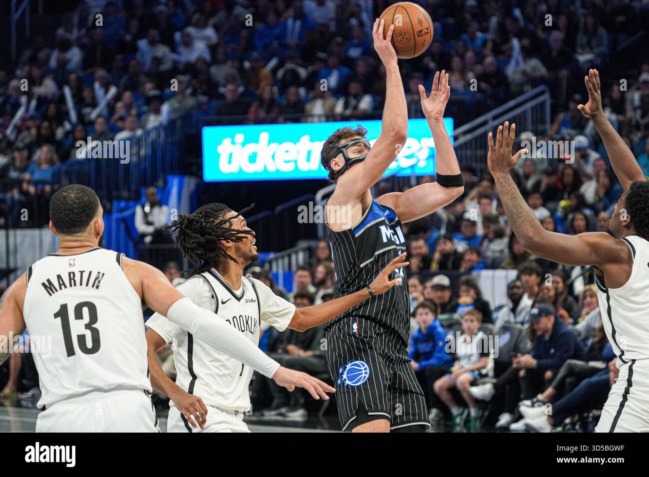 Orlando, Florida, USA, November 14, 2025, Orlando Magic forward Franz Wagner #22 attempt to ...