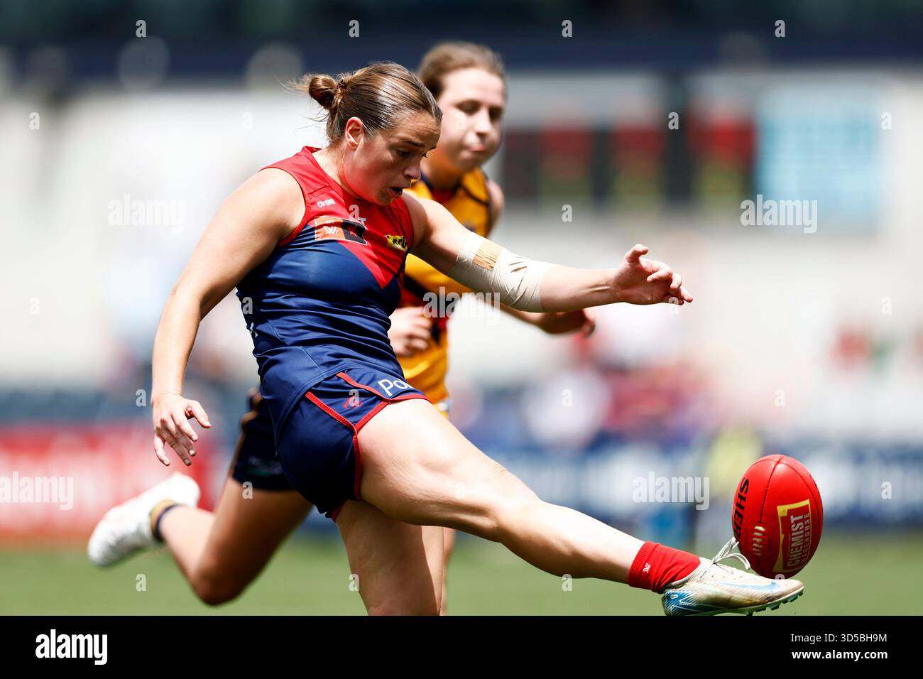 Maggie Mahony of the Demons kicks a goal during the AFLW Semi Final ...
