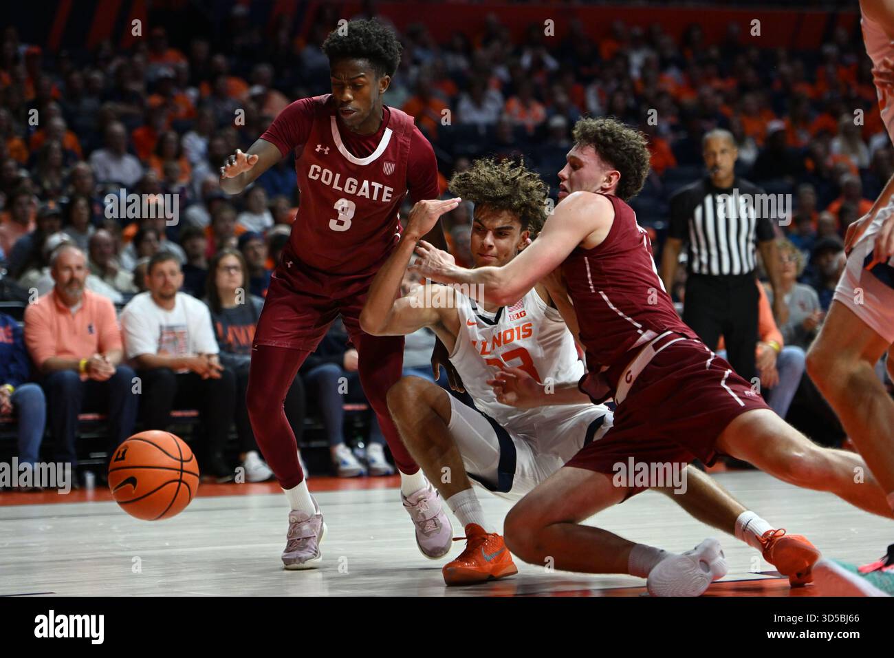 Illinois' Keaton Wagler (23) battles Colgate's Jalen Cox (3) and Brady ...